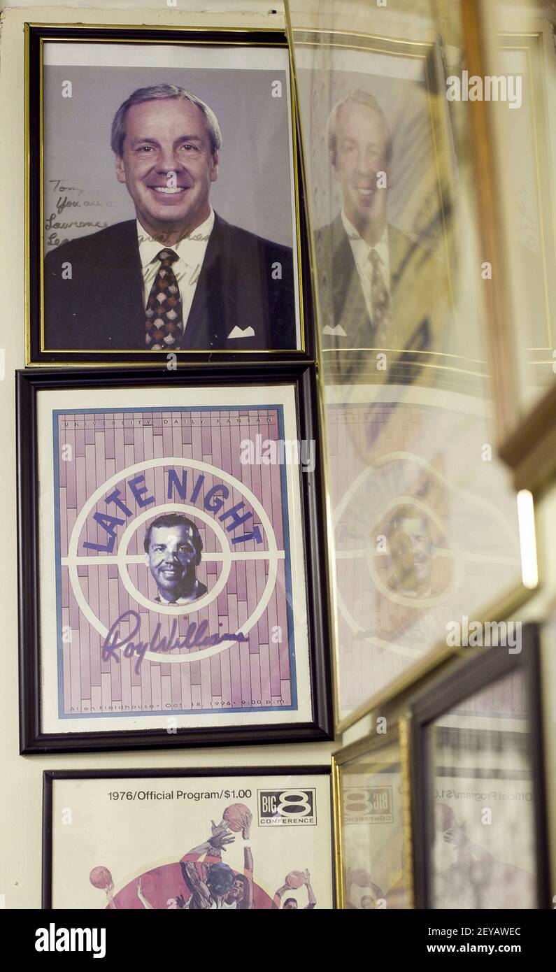 Photographs of Roy Williams hang in the back of Amyx's Barber Shop in ...