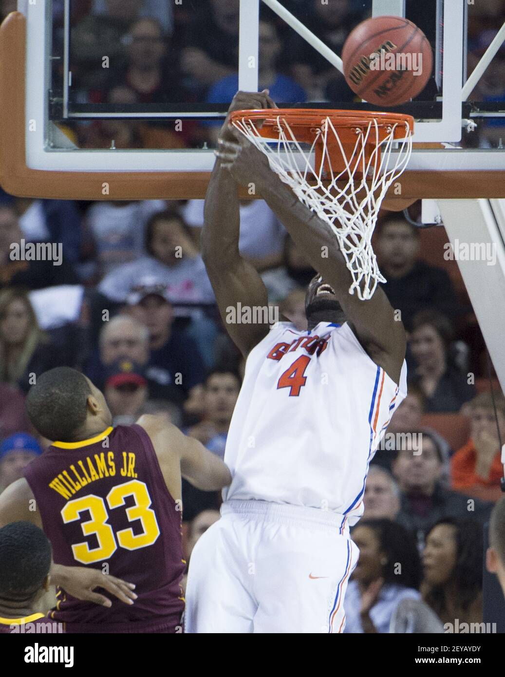 Patrick Young (4) of Florida puts up a shot in front of Rodney Williams ...