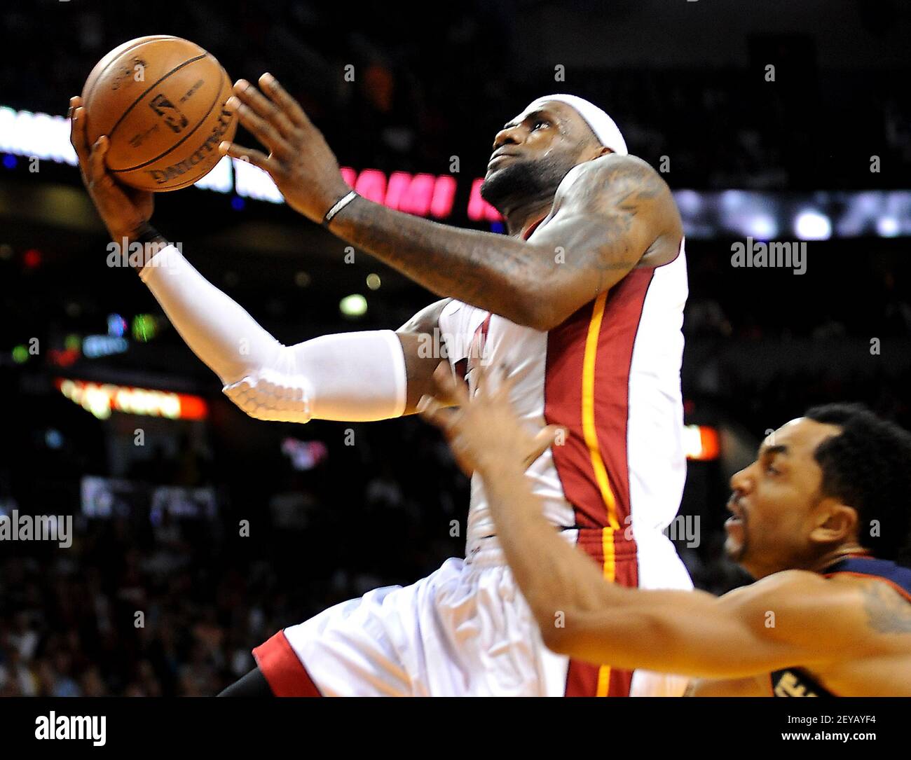 Miami Heat's LeBron James drives to the basket past Charlotte Bobcats ...