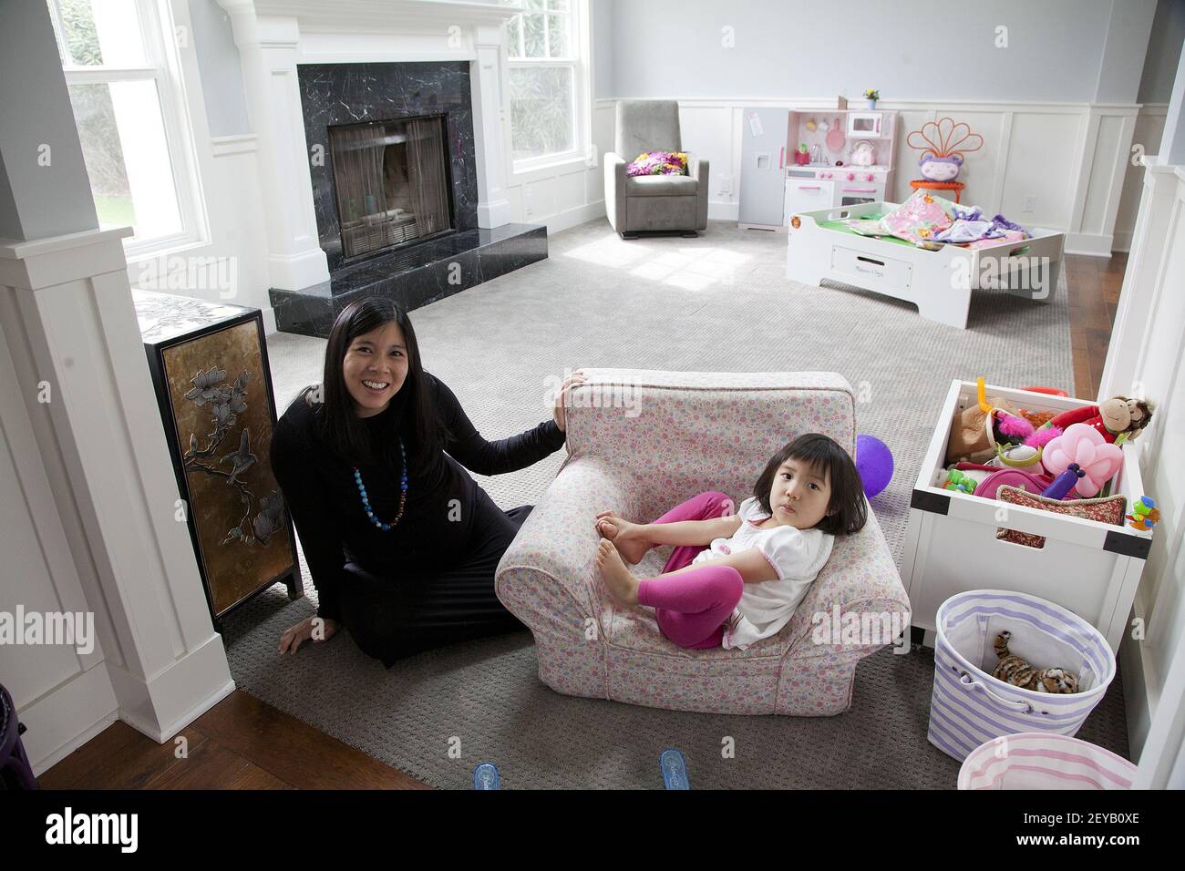 Winnie Cheng and her daughter, Sabrina, pose in the family room of ...
