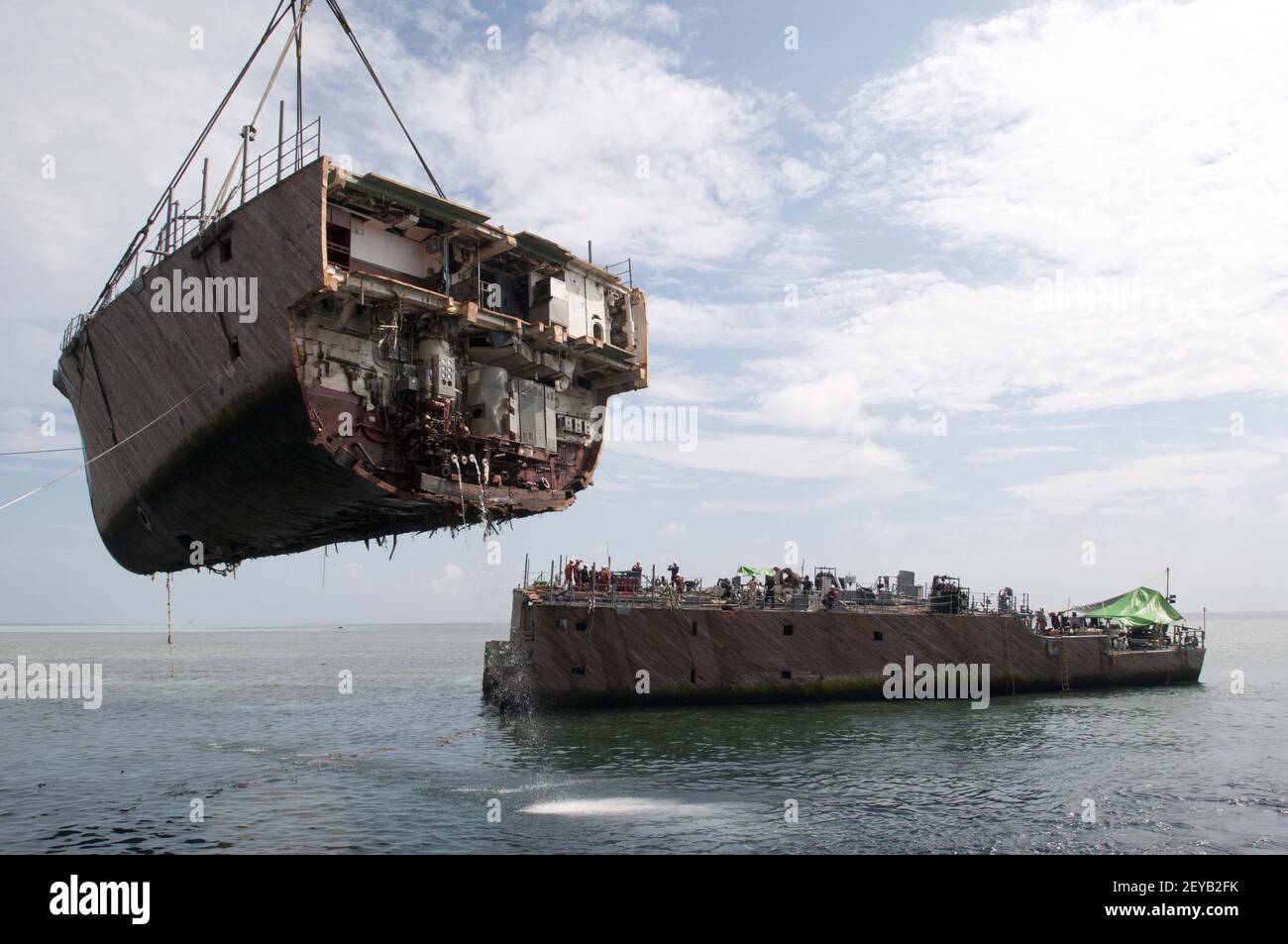 The U.S. Navy-contracted crane vessel Jascon 25 removes the bow from ...