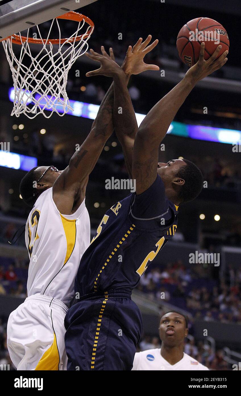 La Salle's Jerrell Wright shoots over Wichita State's Carl Hall, left ...
