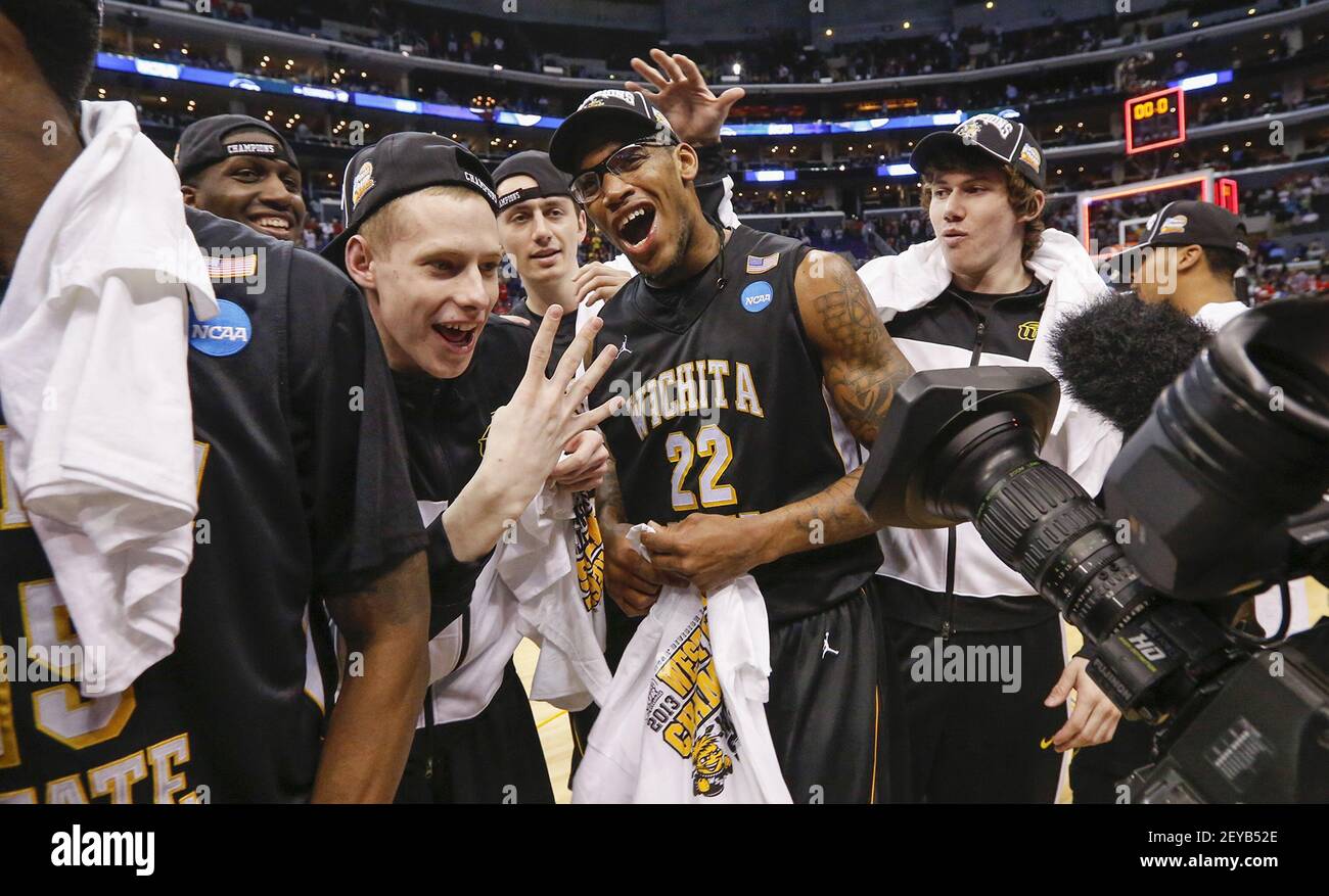 Wichita State's Zach Bush and Carl Hall (22) celebrate 70-66 win ...