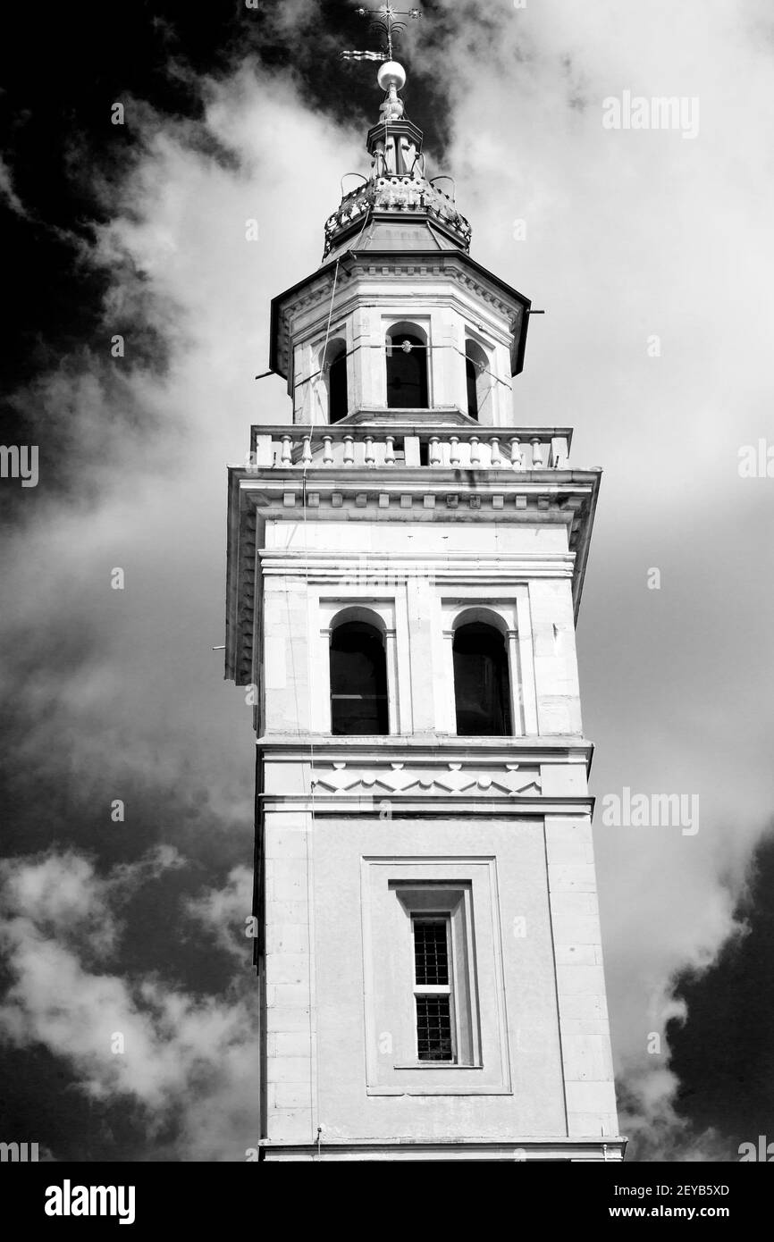 Monument clock tower in italy europe old stone and bell Stock Photo - Alamy