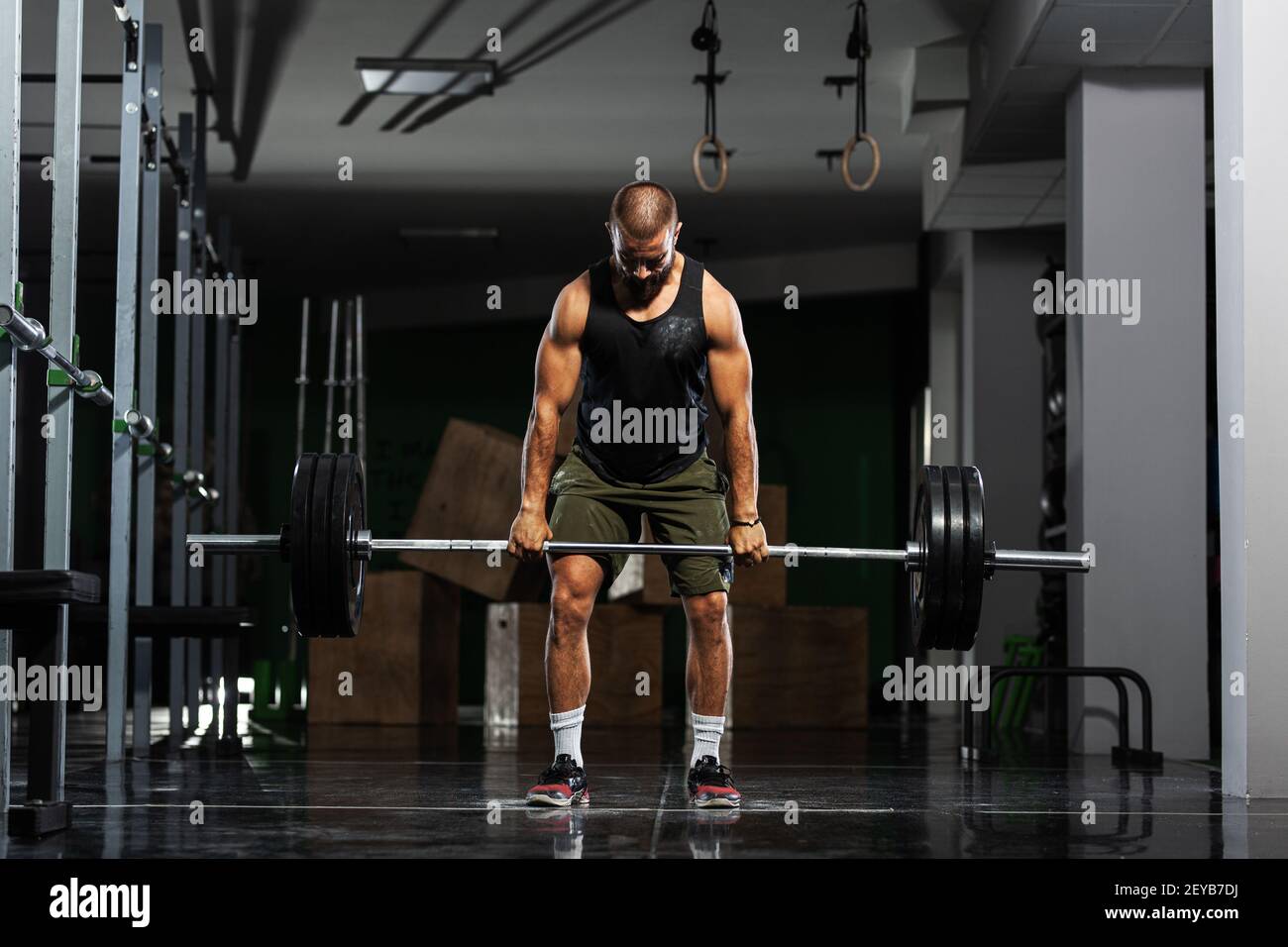 Muscular athlete lifting very heavy barbell Stock Photo - Alamy