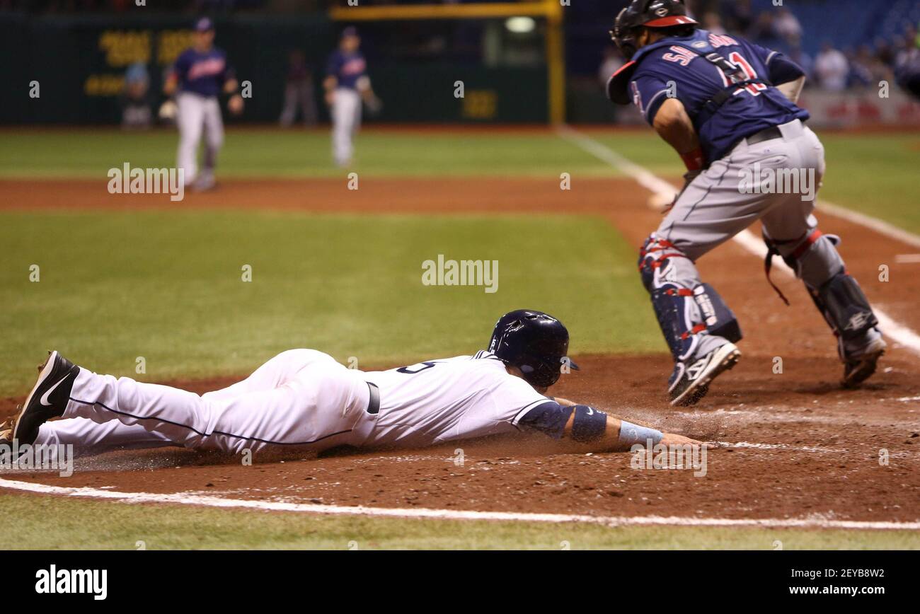 The Tampa Bay Rays' Sam Fuld beats the throw home to Cleveland Indians ...