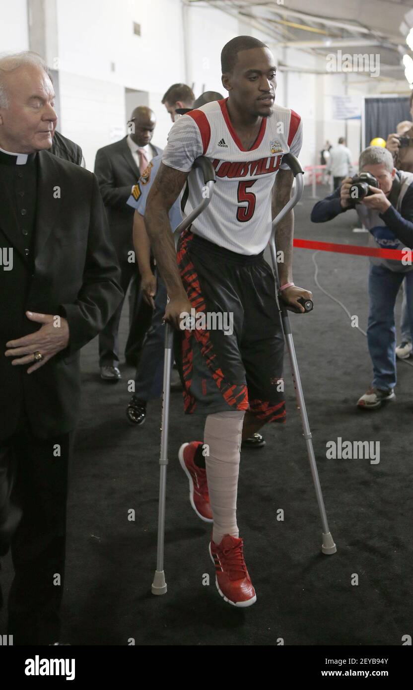 Kevin Ware (5) of the Louisville Cardinals joins his teammates on the ...