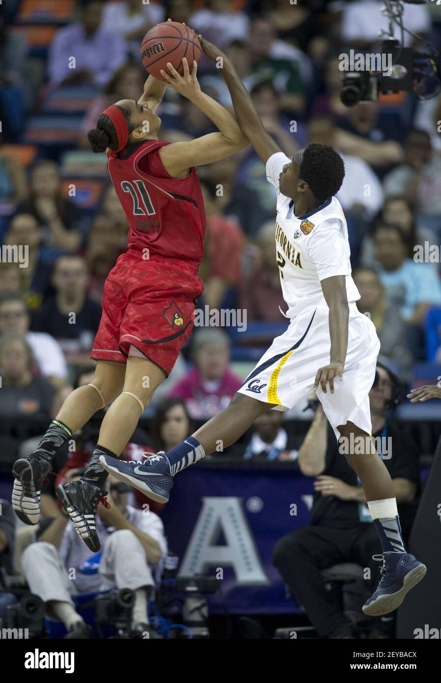 California's Afure Jemerigbe (2) tries to block the shot of Louisville ...