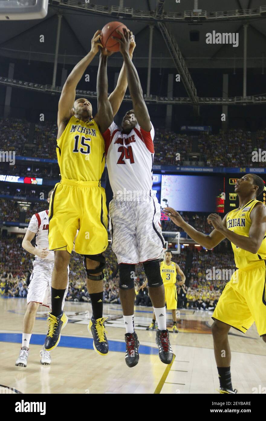Jon Horford (15) of the Michigan Wolverines and Montrezl Harrell (24 ...
