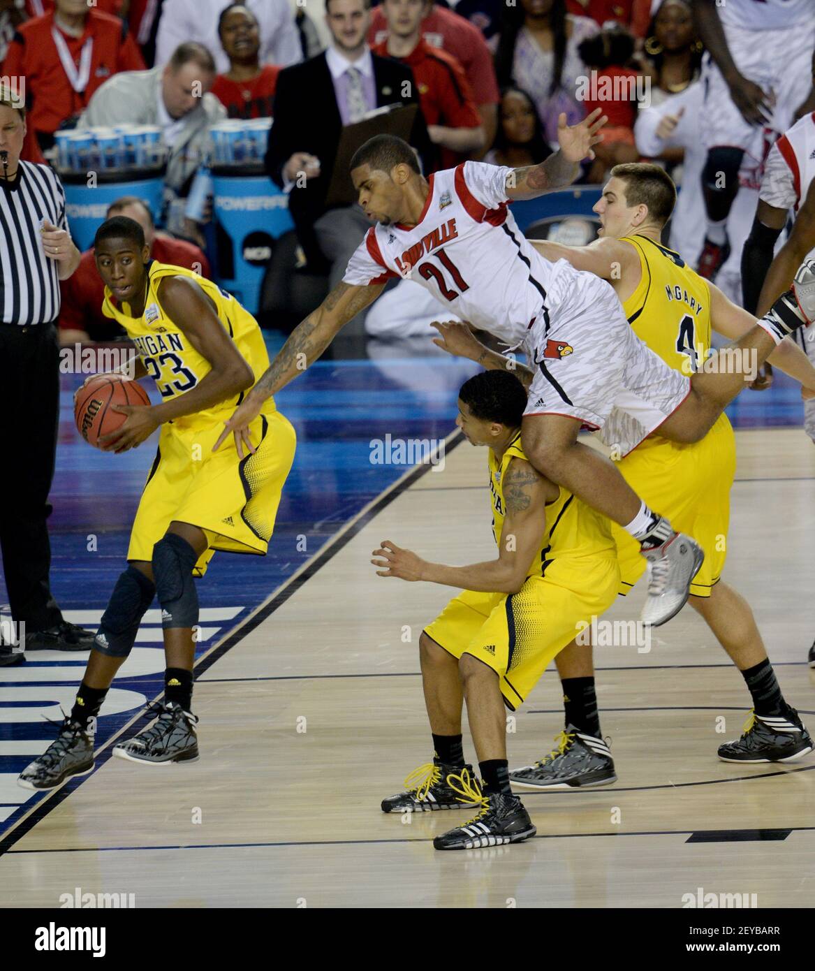 Caris LeVert (23) of the Michigan Wolverines lands out of bounds on a ...