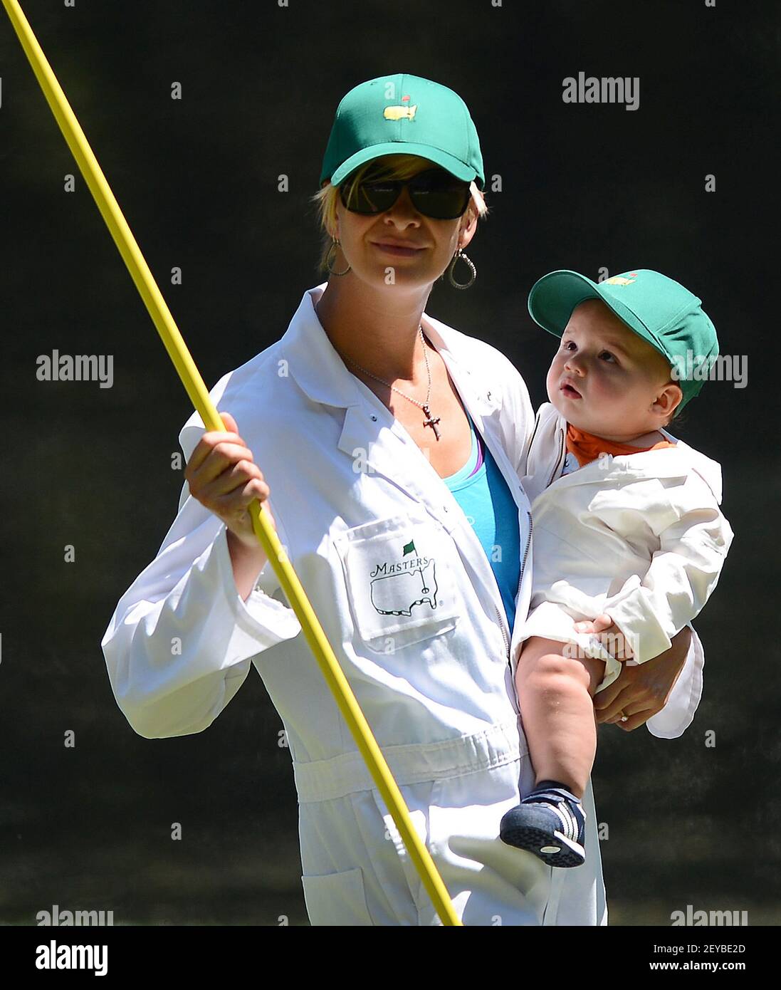 Angie Watson pulls the pin for her husband, Bubba Watson, as their son ...