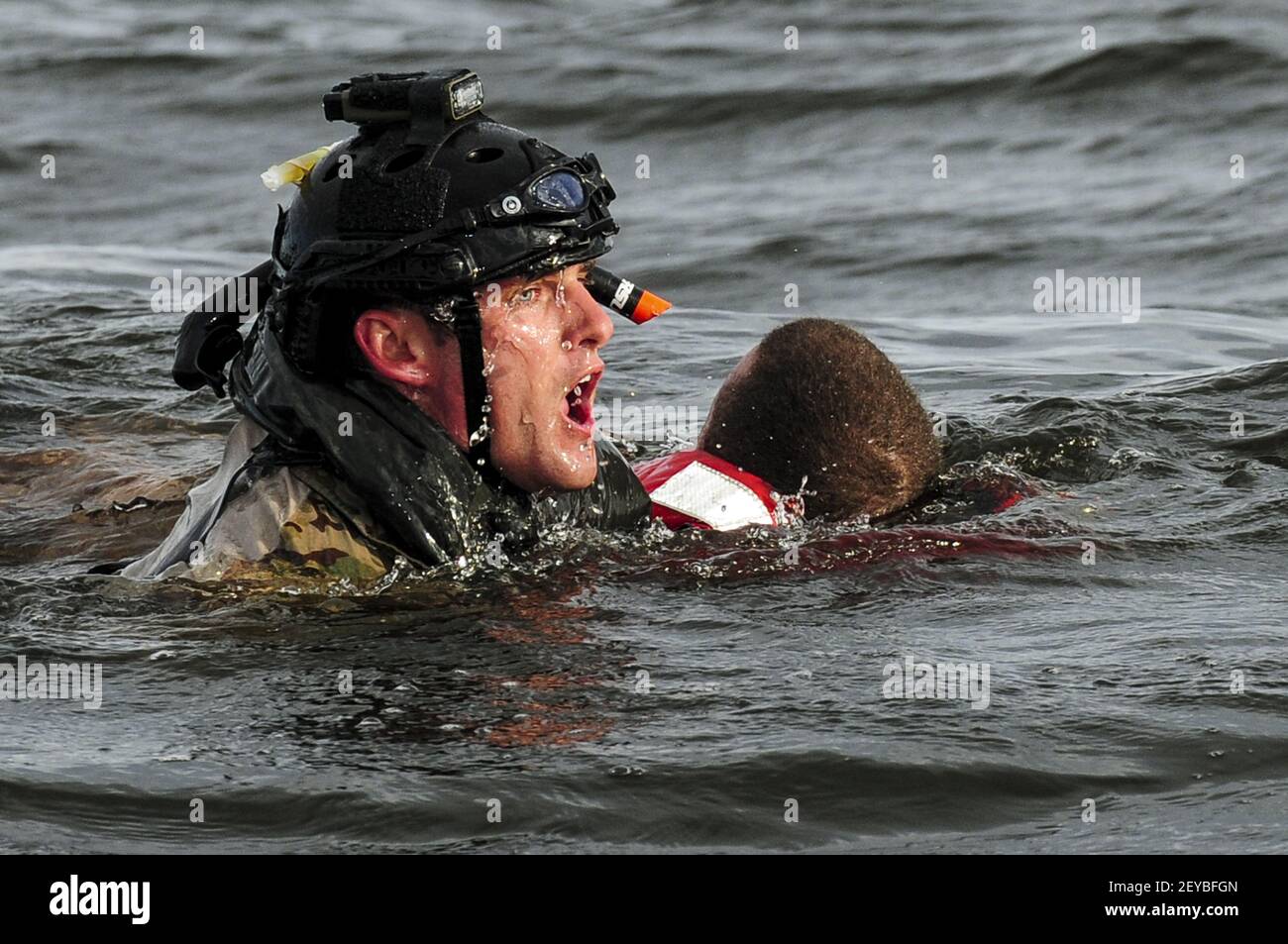 A U.S. Airman with the 23rd Special Tactics Squadron (STS) swims to a ...