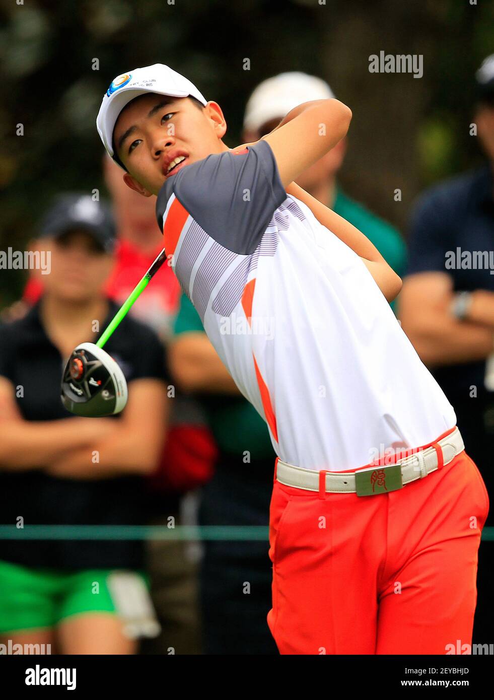 Tianlang Guan, 14 years old, tees off on the 15th hole during the final ...