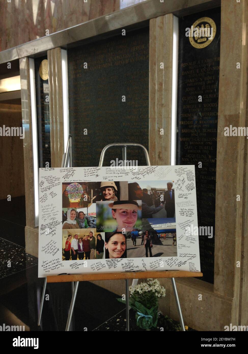 A photo board with photos of Anne Smedinghoff, a Foreign Service ...
