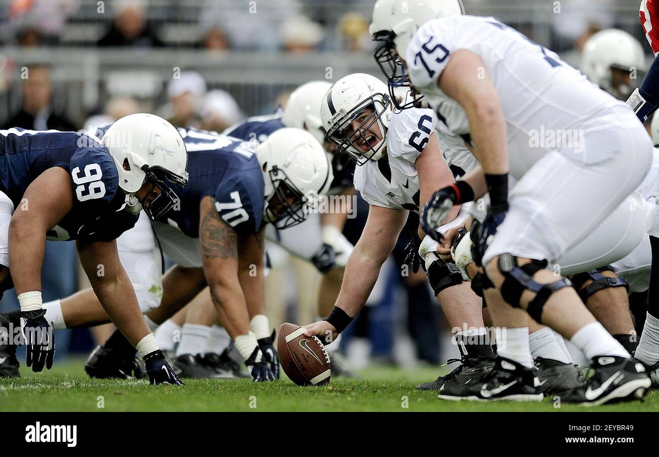 Penn State center Ty Howle yells down the line before he snaps the ball ...