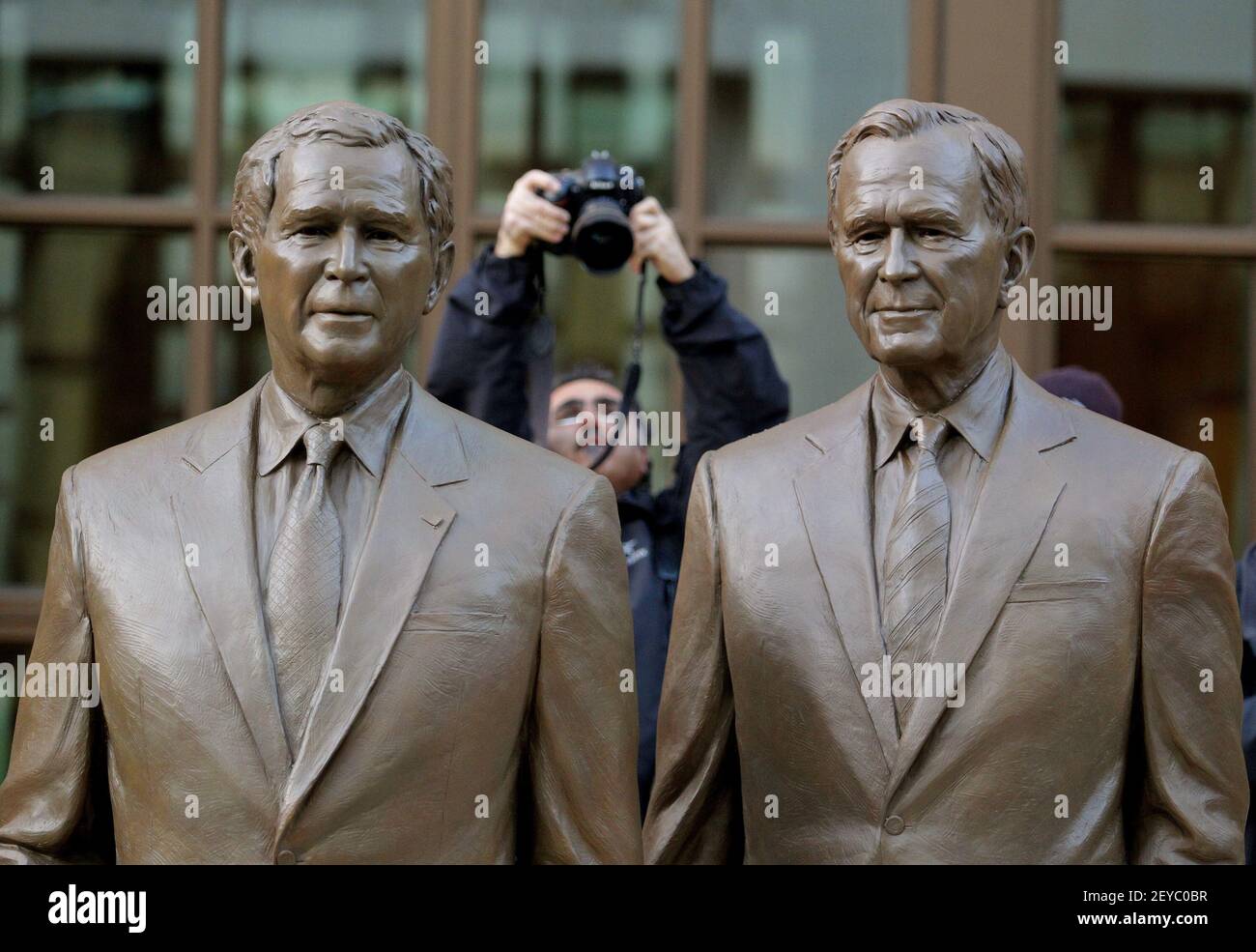 A photographer makes a photo of the two bronze statues of former United ...