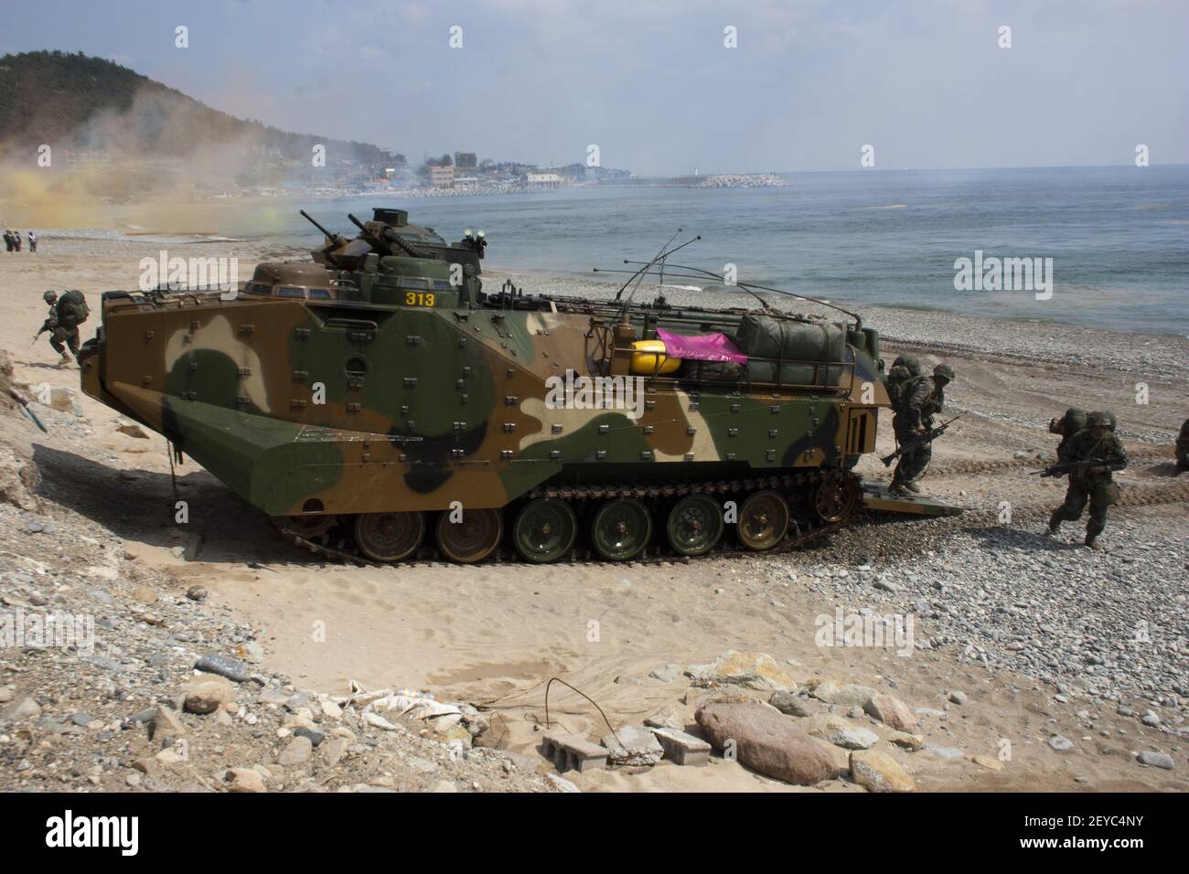 South Korean Marine LVT-7 landing craft sail to shores in a smoke ...