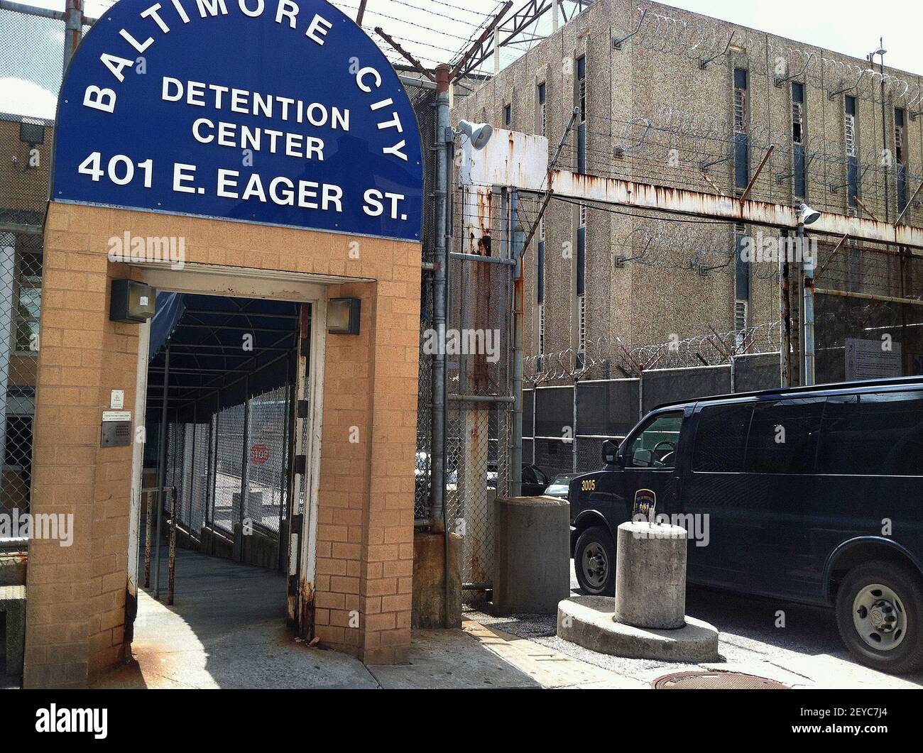 A prison van drives past the entrance to the Baltimore City Detention ...