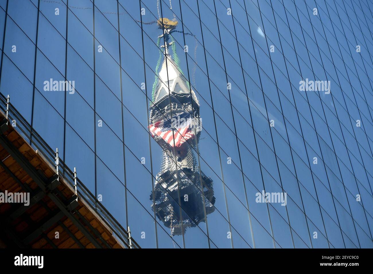 Reflected in the glass facade of One World Trade Center , he final 408 ...