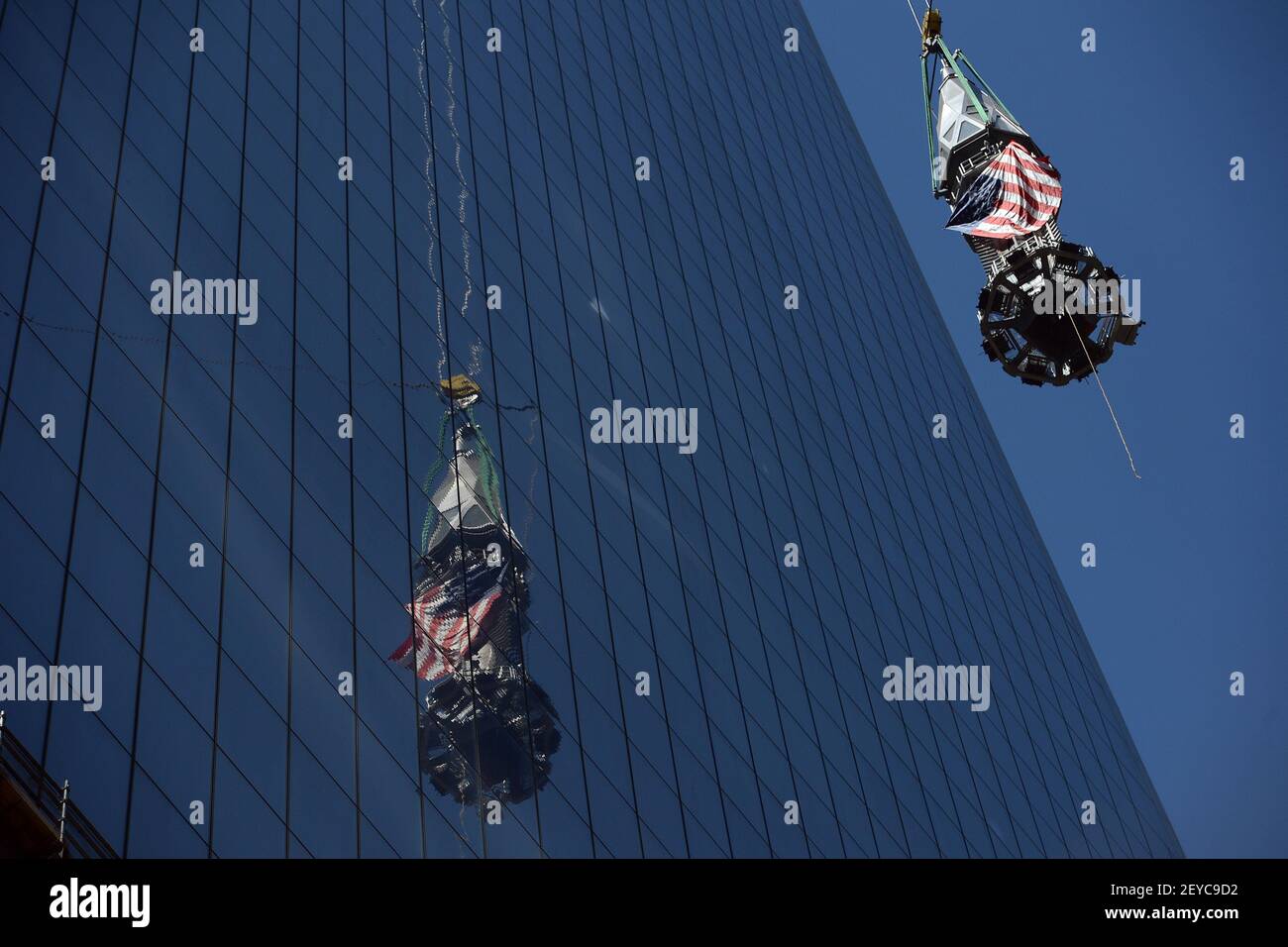 Reflected in the glass facade of One World Trade Center , he final 408 ...