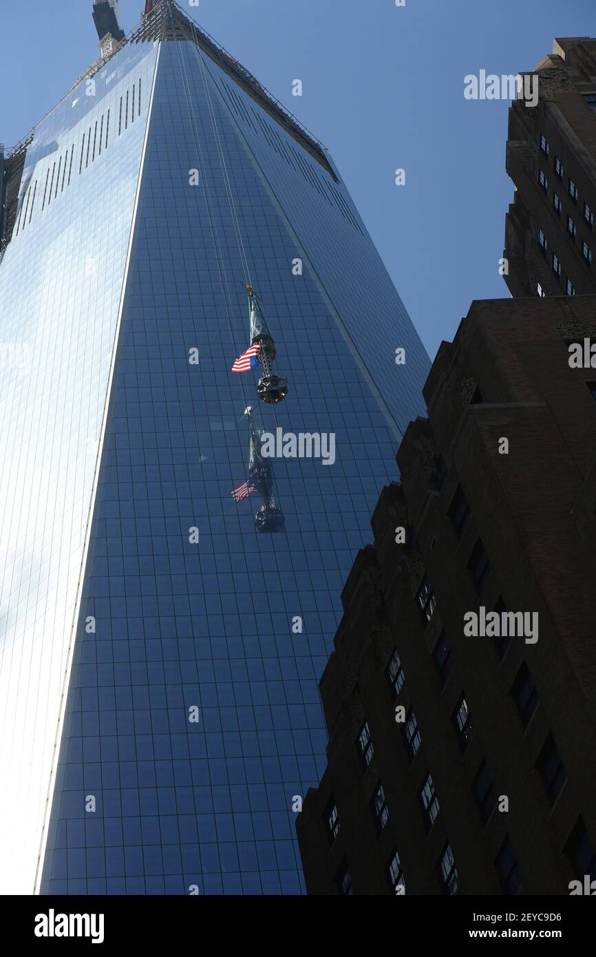Reflected in the glass facade of One World Trade Center , he final 408 ...