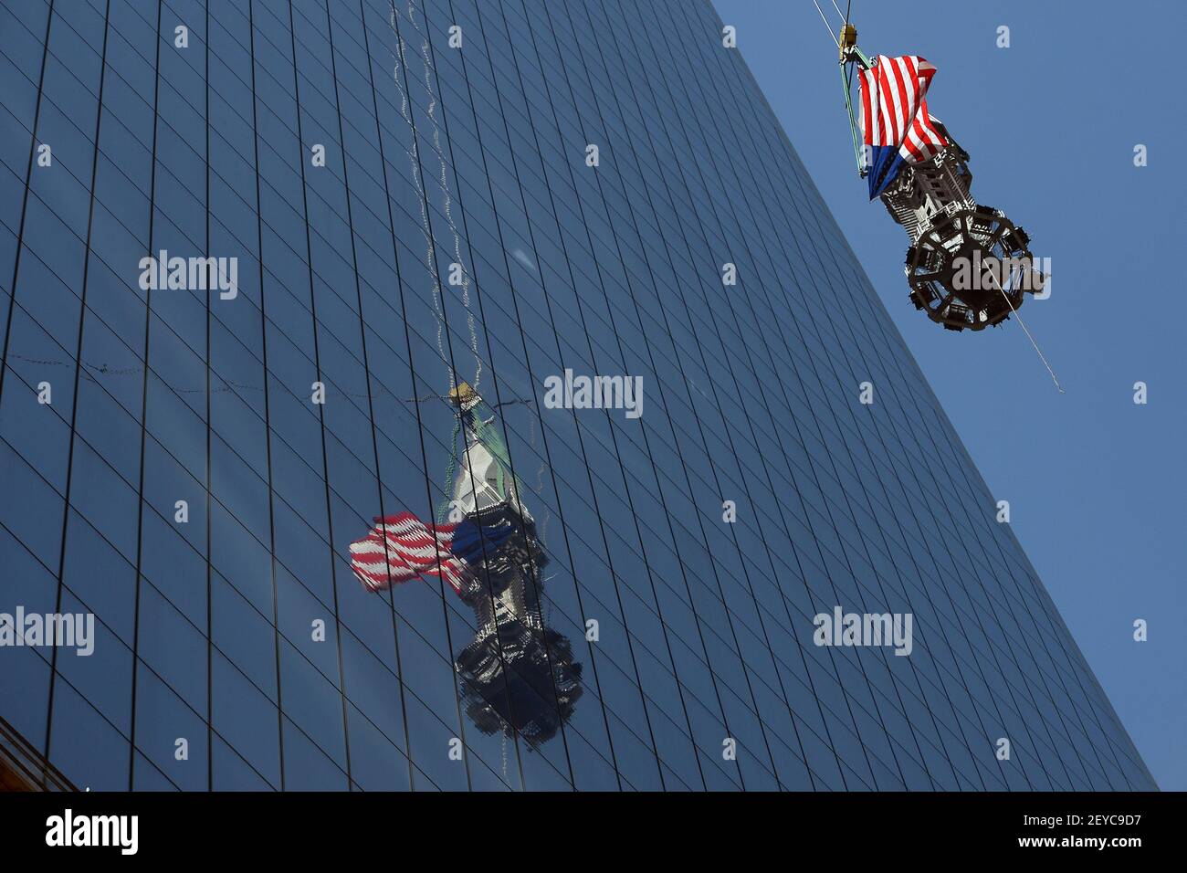 Reflected in the glass facade of One World Trade Center , he final 408 ...