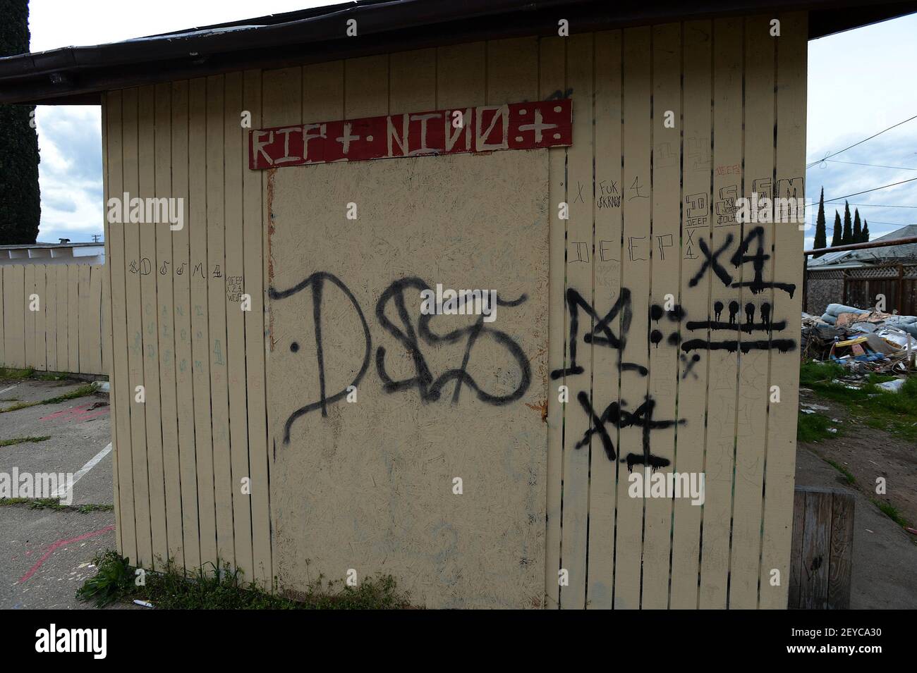 An alley shows where gang graffiti is visible in south Modesto ...