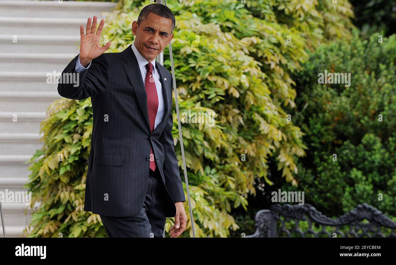 President Barack Obama walks across the South Lawn as he departs the ...