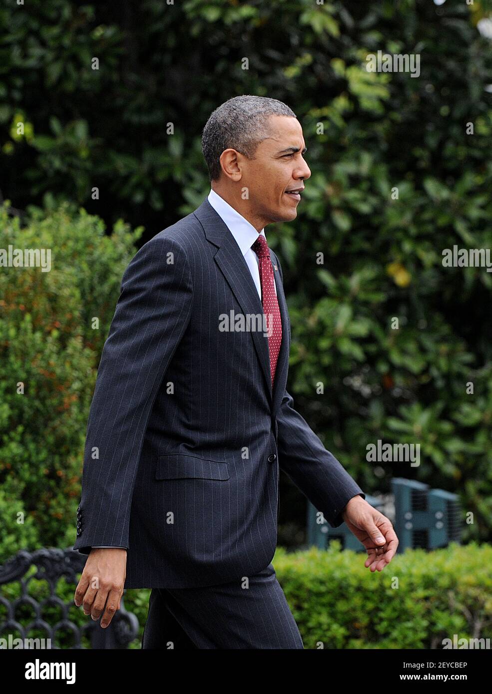 President Barack Obama walks across the South Lawn as he departs the ...