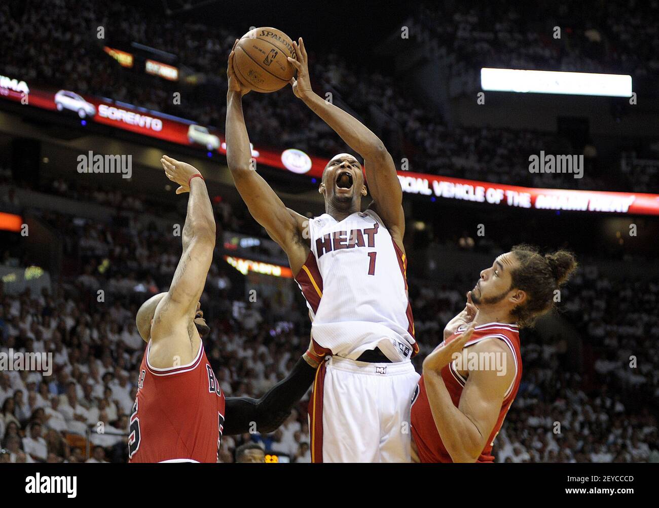Miami Heat forward Chris Bosh drives to the basket between Chicago ...