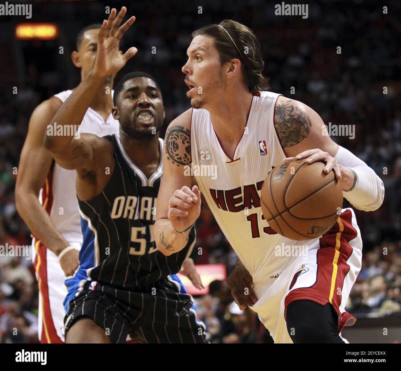 The Miami Heat's Mike Miller works against the Orlando Magic's E'Twaun ...