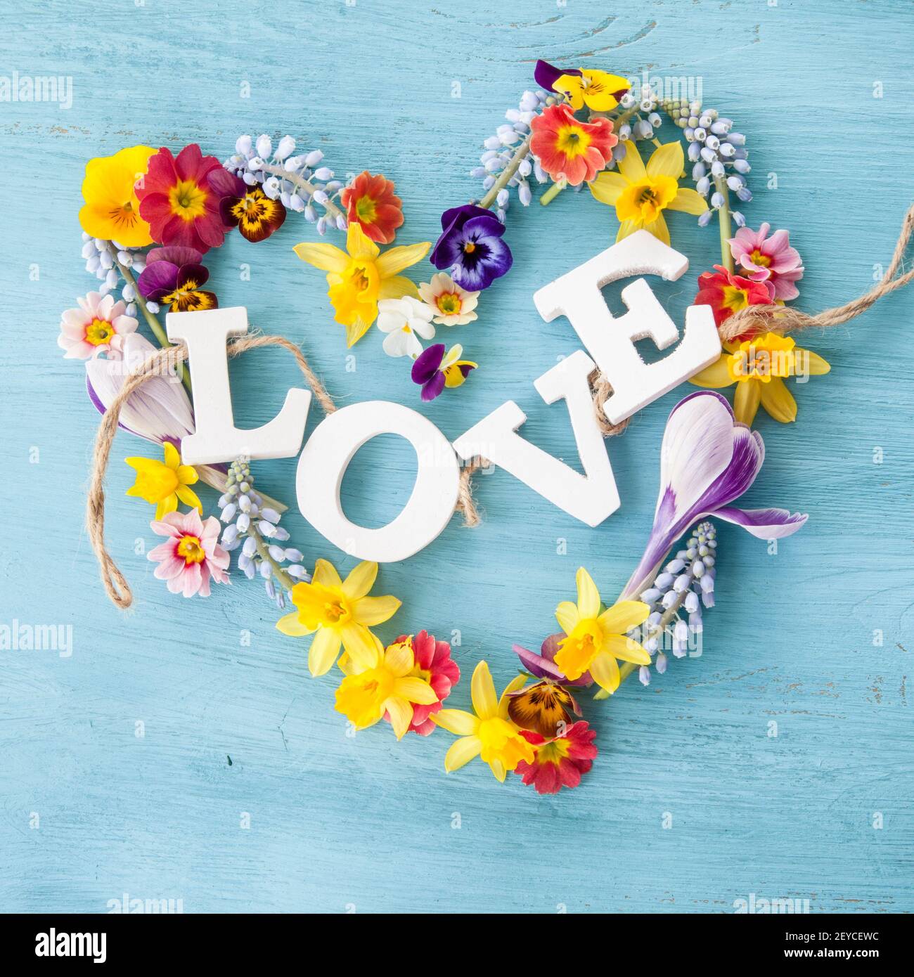 Spring flowers in heart shape Stock Photo - Alamy