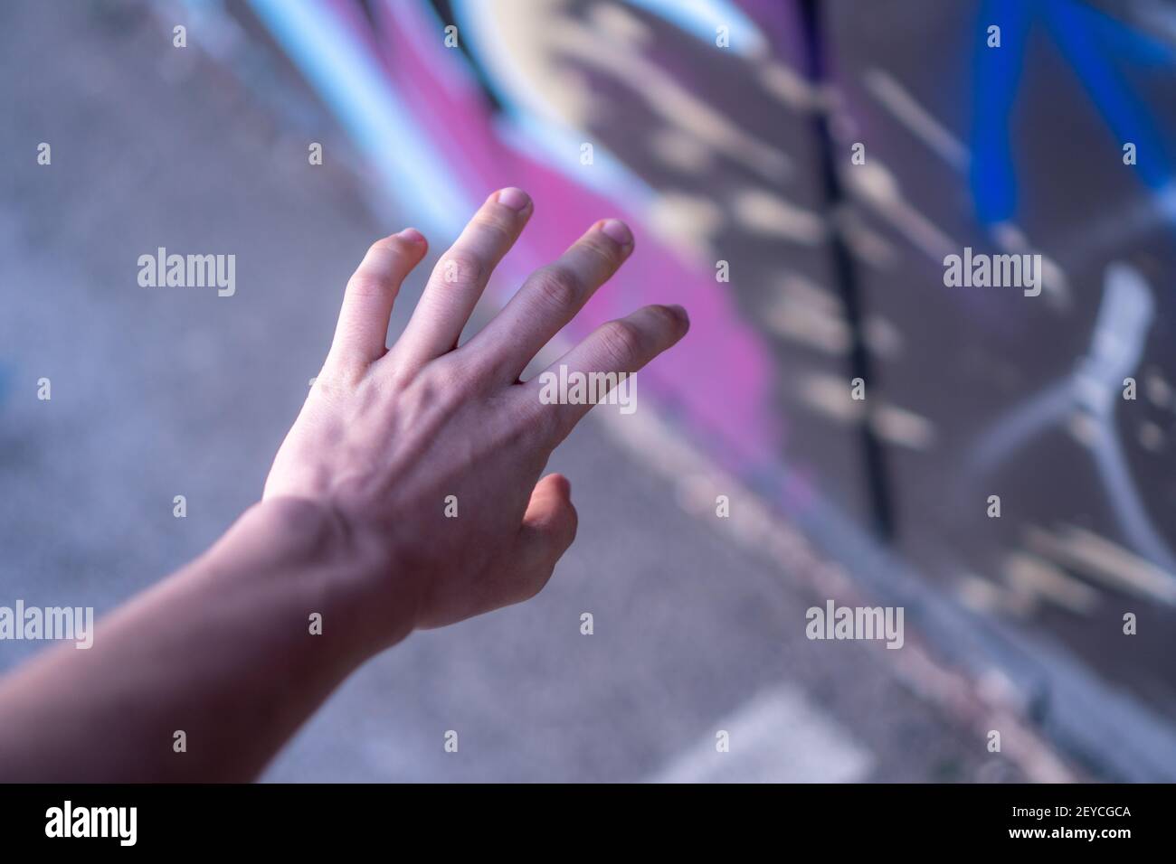 A high angle of aleft hand trying to grab something Stock Photo - Alamy