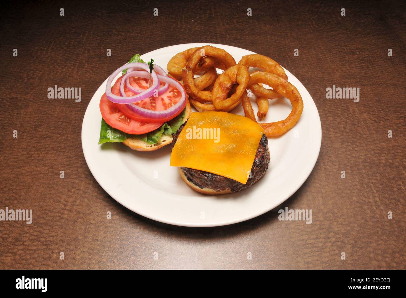 Delicious cheeseburger with all the fixings on a bun Stock Photo - Alamy