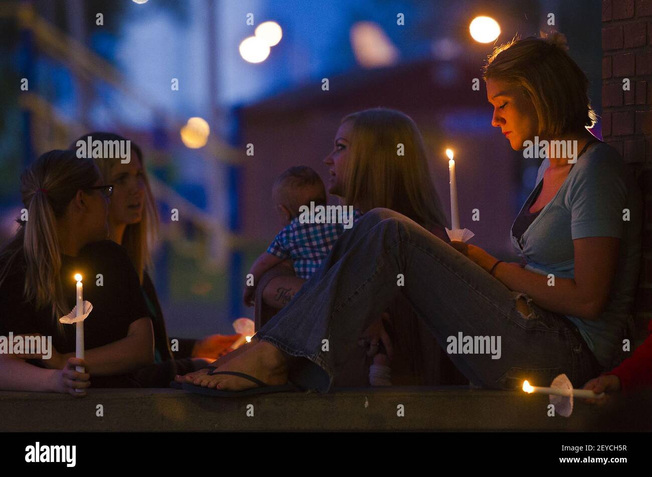 Shona Osladil holds a candle on Friday, May 10, during a vigil for the ...