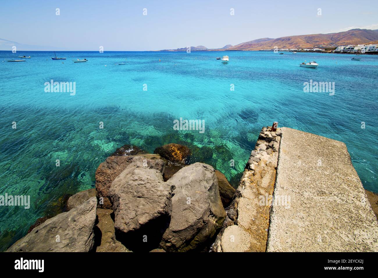 Village rusty metal yacht spain harbor Stock Photo - Alamy