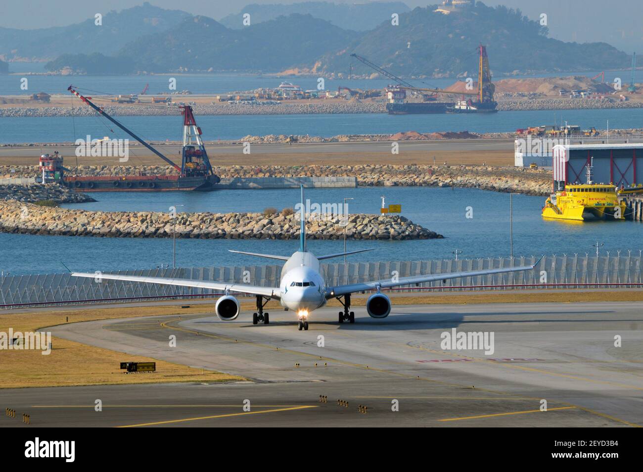 Cathay Pacific aircraft at Hong Kong International Airport with Three ...