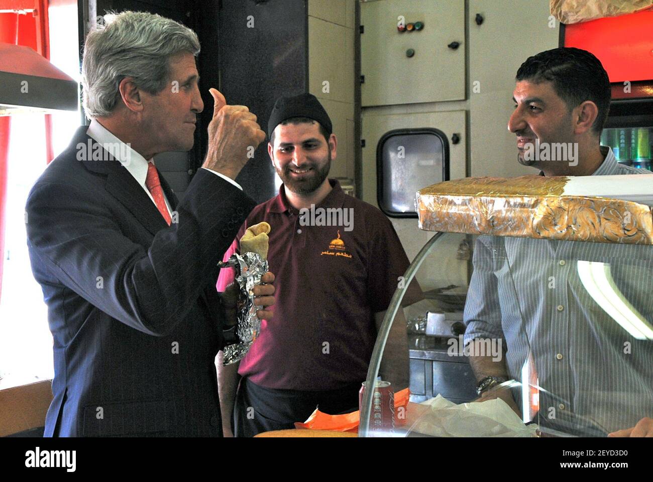 U.S. Secretary of State John Kerry shows his appreciation to the ...