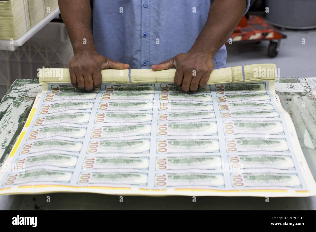 The newly redesigned $100 bill being printed at the Bureau of Engraving ...