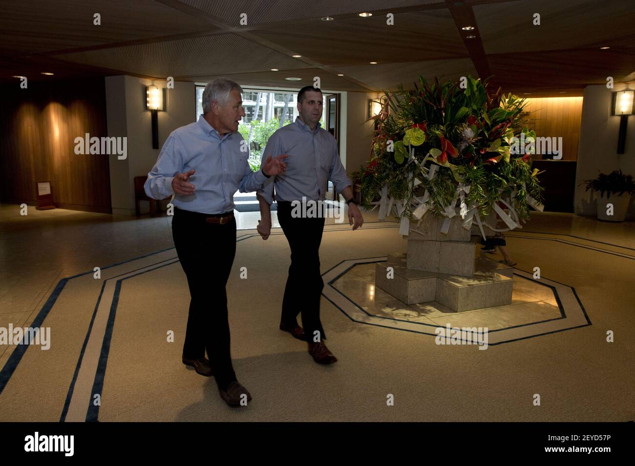 Secretary of Defense Chuck Hagel walks with Mark Lippert, his chief of ...