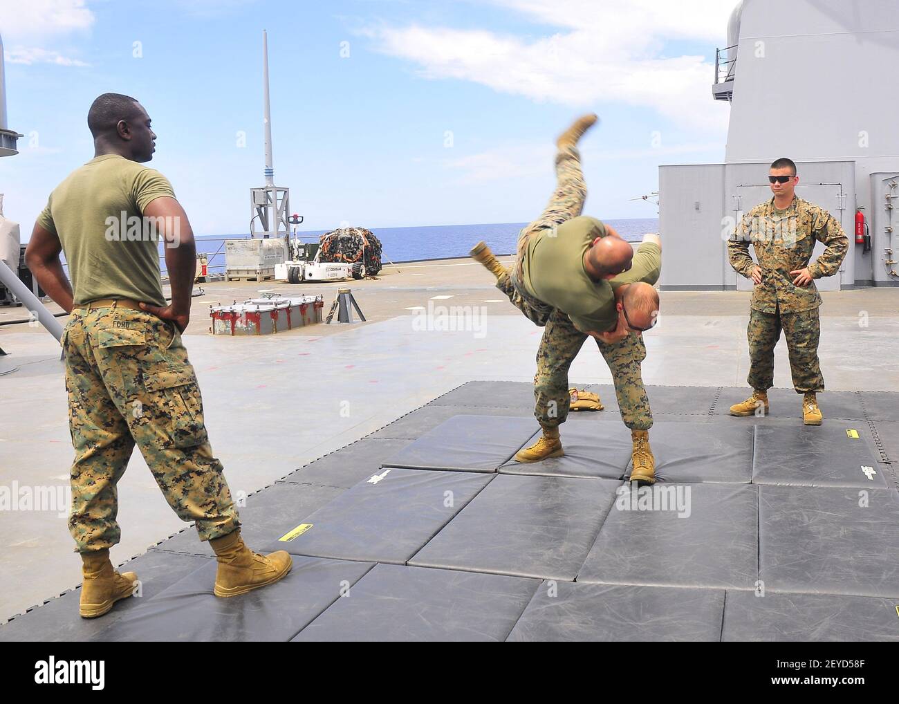 U.S. Marine Corps Capt. Chris Tucker, and Sgt. Gabriel Perez, center ...