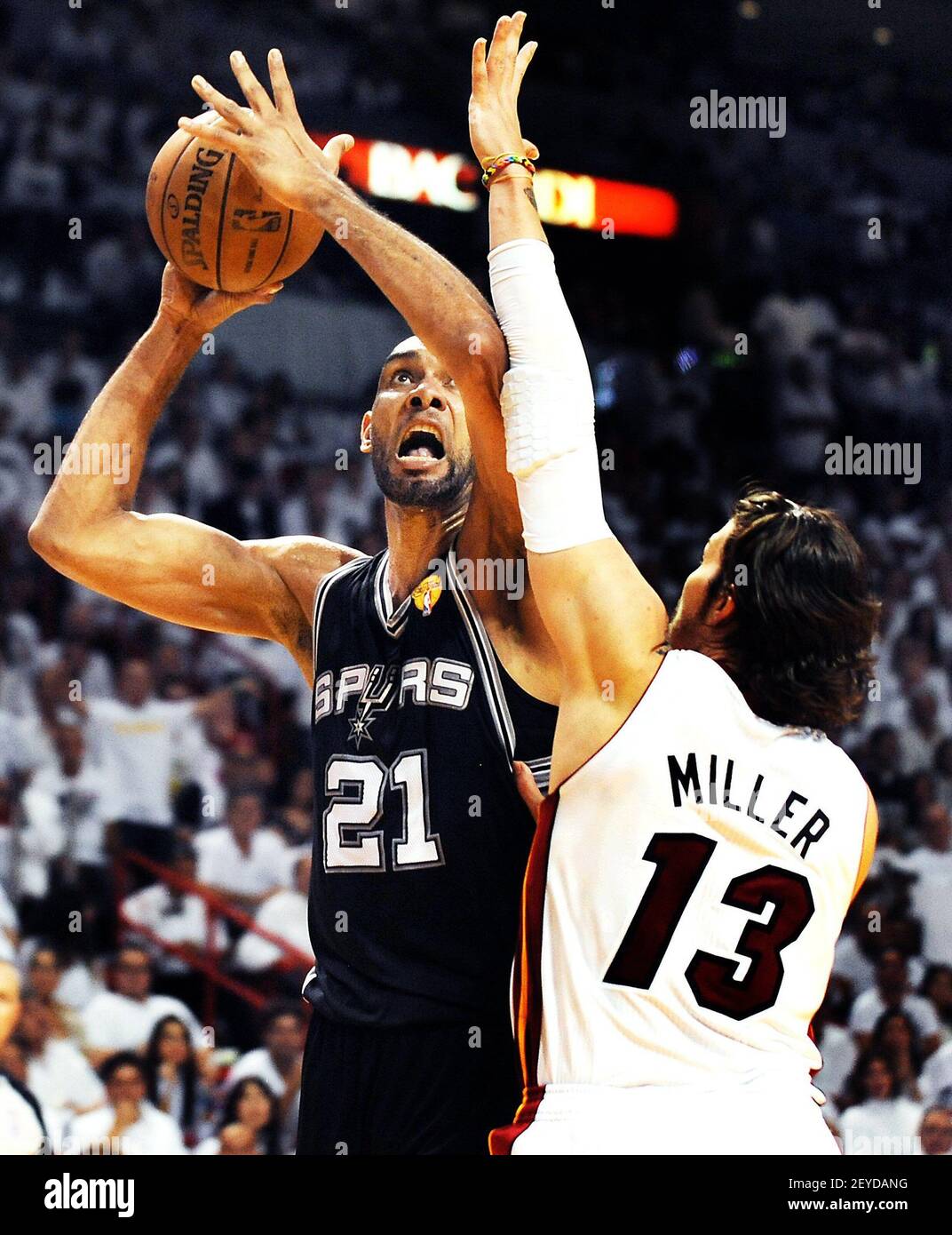 The San Antonio Spurs' Tim Duncan (21) takes shot over the Miami Heat's ...