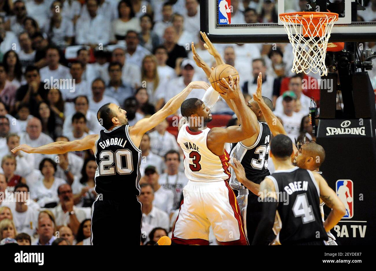 Miami Heat's Dwyane Wade attacks the rim as San Antonio Spurs' Manu ...