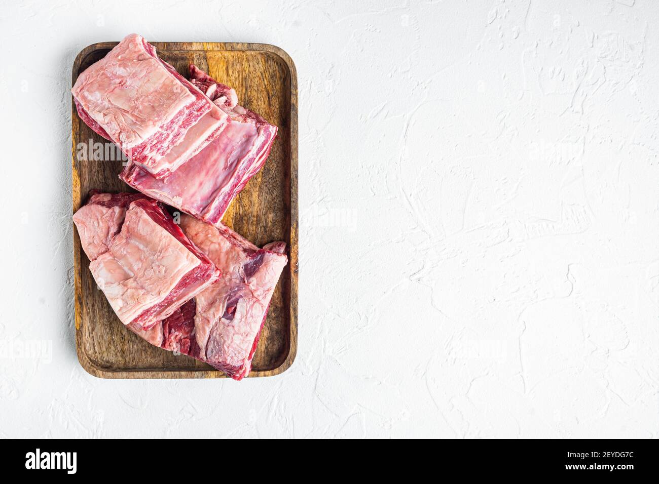 Raw veal calf short rib meat set, on white stone background, top view ...