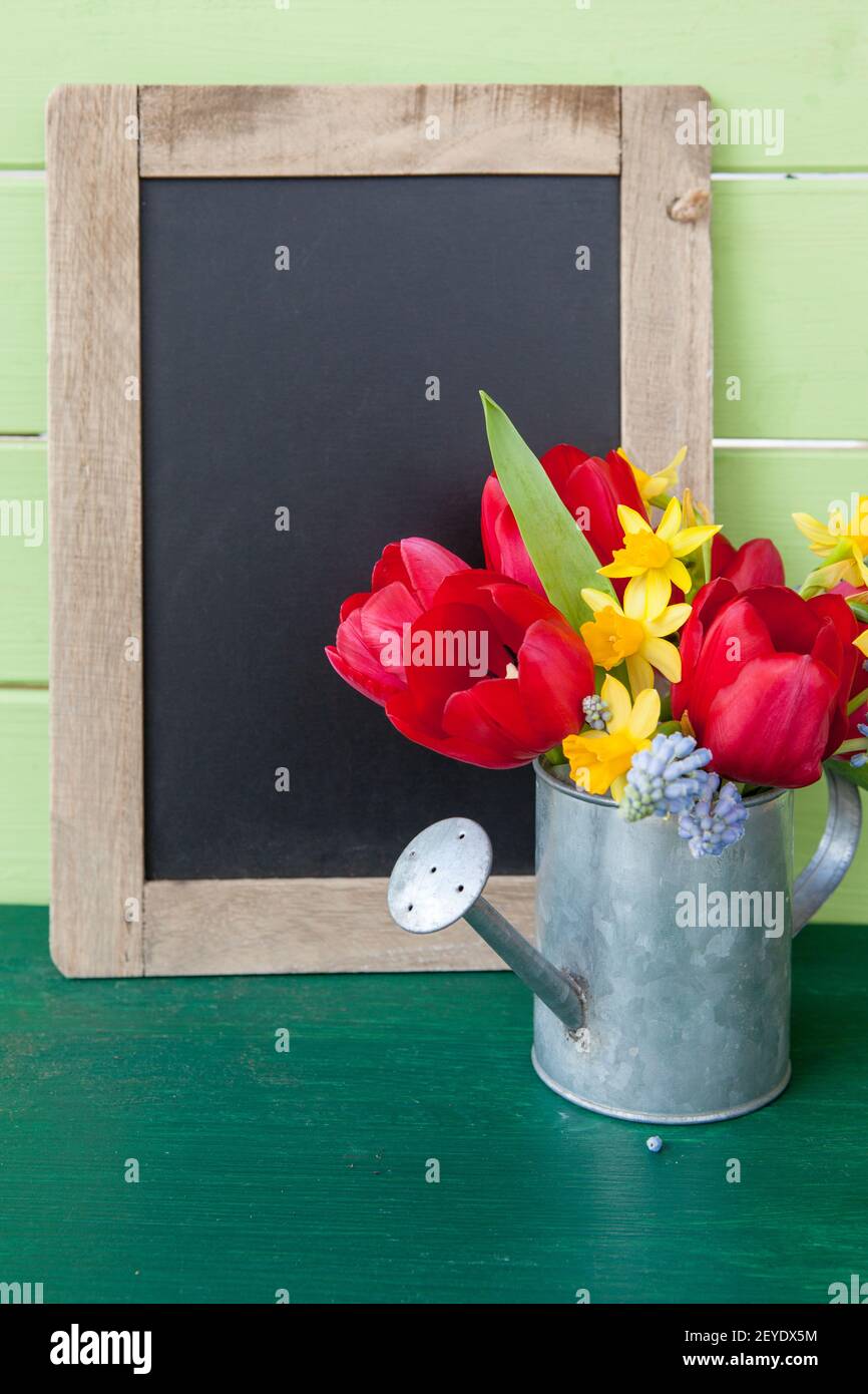 Spring flowers in vintage pot Stock Photo - Alamy