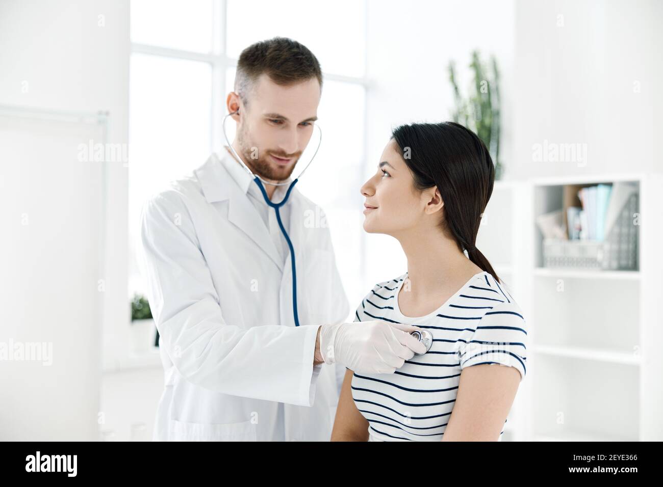 male doctor examines a patient in health hospitals Stock Photo - Alamy