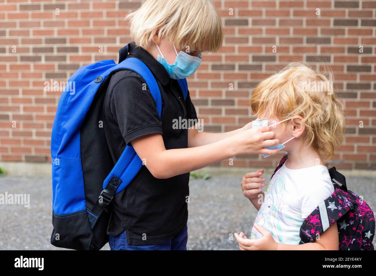 Kids in masks. Back to school concept after reopening. Schoolboy ...