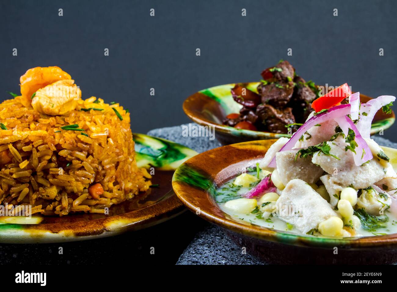 full meal, rice with chicken, roast beef, fish ceviche on stone Stock ...