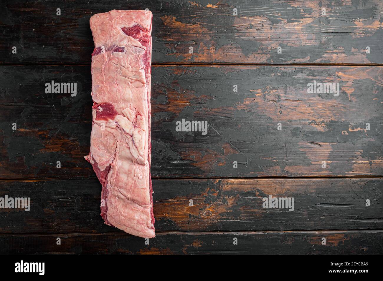Raw Organic Beef Short Ribs Ready to Cook set, on old dark wooden table ...