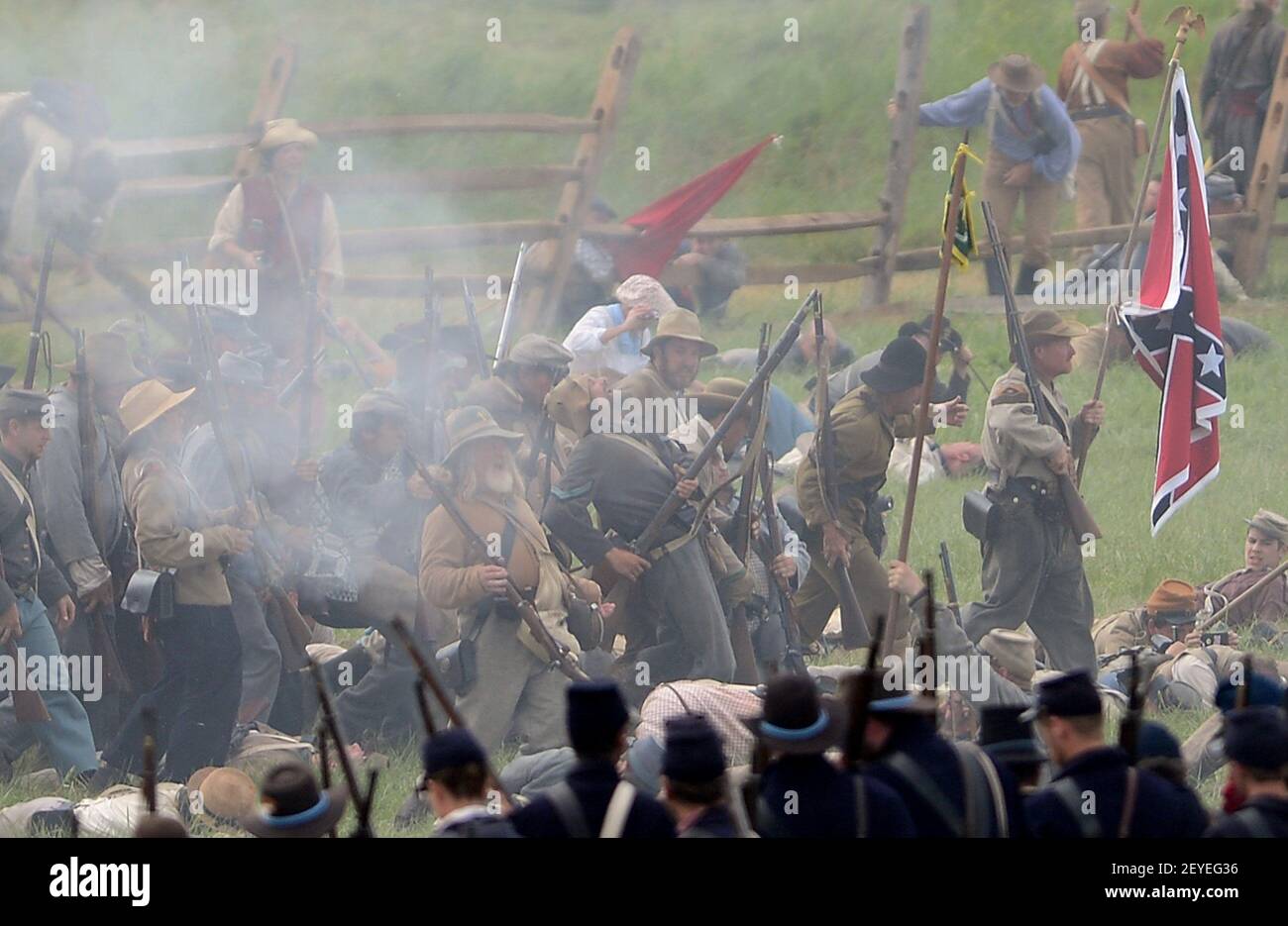 Confederate infantry re-enactors battle their Union counterparts during ...